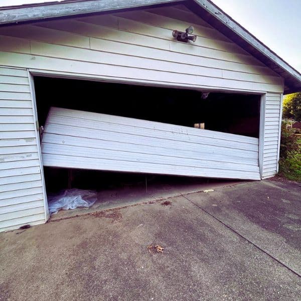 Understanding Off-Track Garage Doors: Causes and Risks